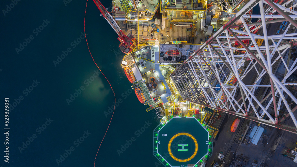 Aerial view jack up rig under maintenance at night, Aerial view of jack ...