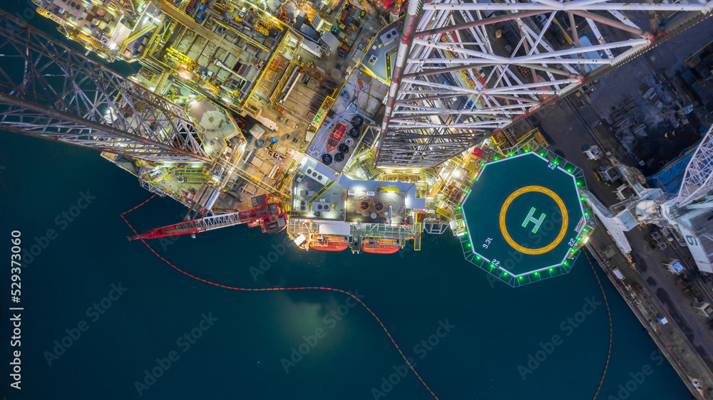 Aerial view jack up rig under maintenance at night, Aerial view of jack ...