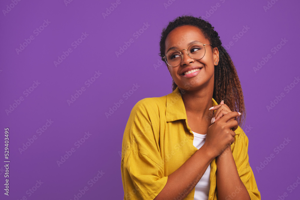 Young cheerful African American woman millennial look around and smile ...