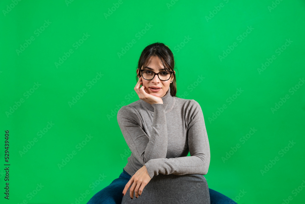 Young beautiful woman or girl model posing in front of green screen ...