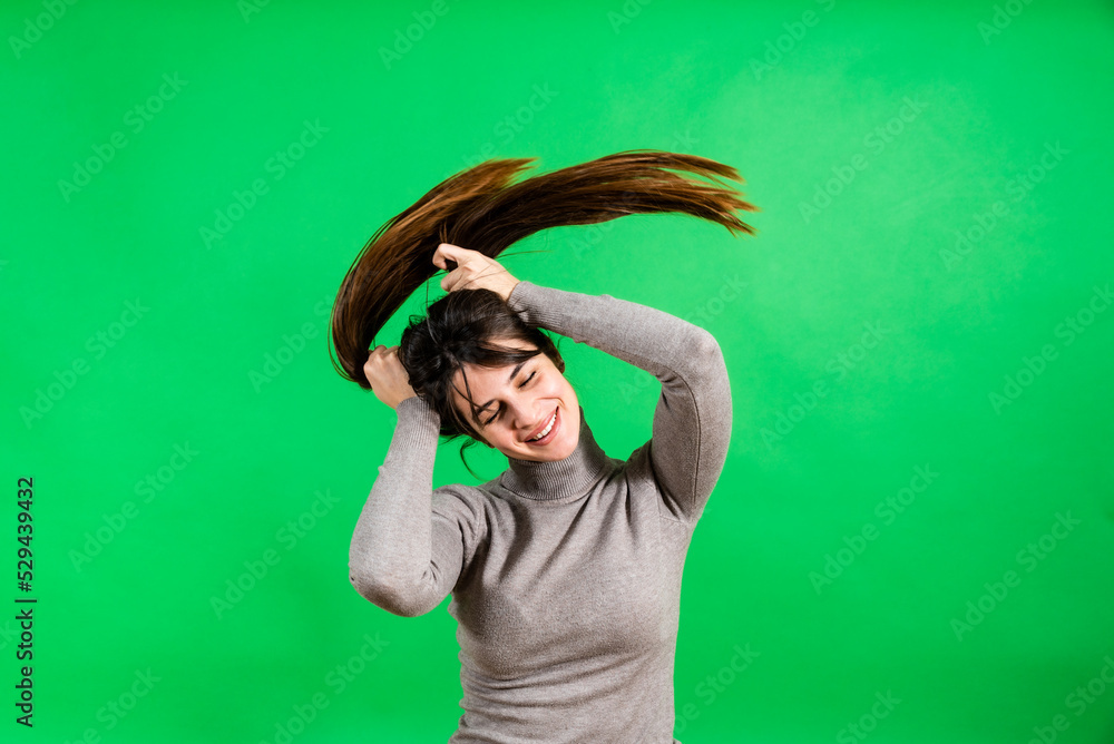 Young beautiful woman or girl model posing in front of green screen ...