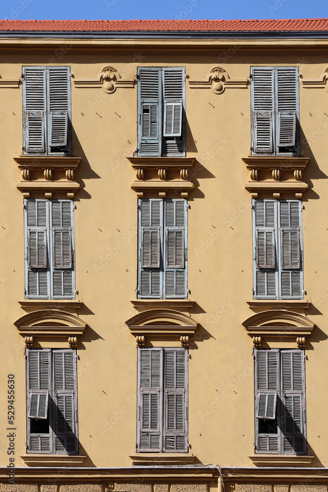 Typical facade in the south of France, on the French Riviera, windows ...