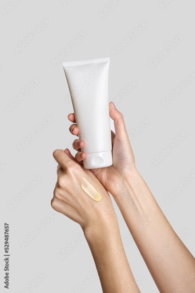 Woman hand showing cream product. Cosmetic product branding mockup ...