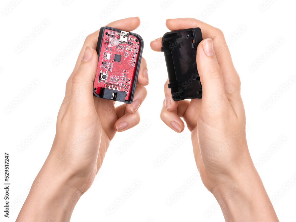 Female hands holding an open case of debugger flasher board red color ...
