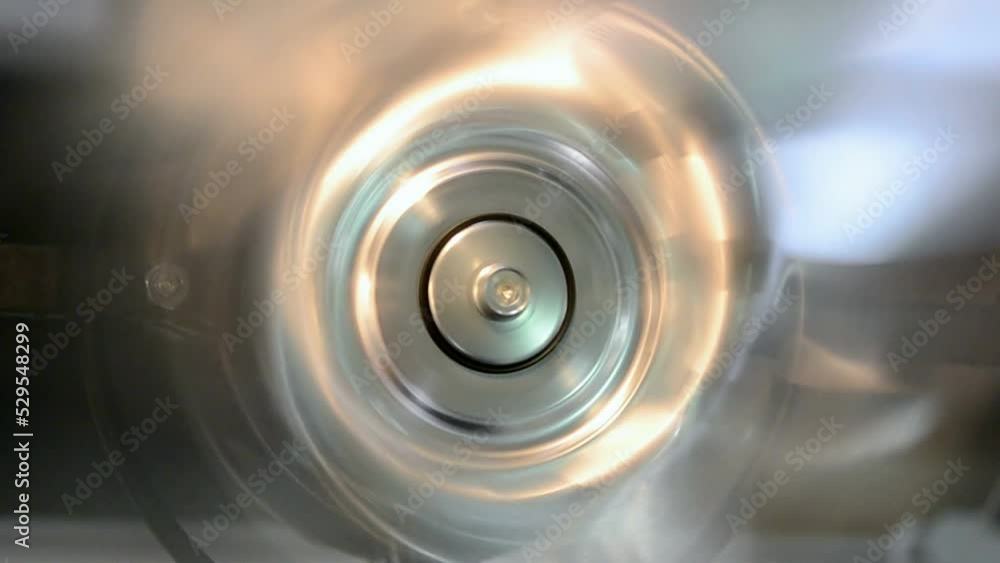 rotated silver industrial metal ring closeup with vibrance effect ...