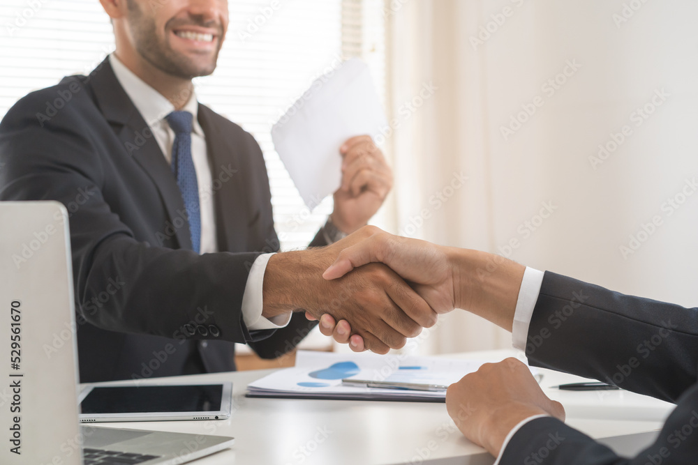 Handshake, caucasian male giving financial reward in an envelope ...