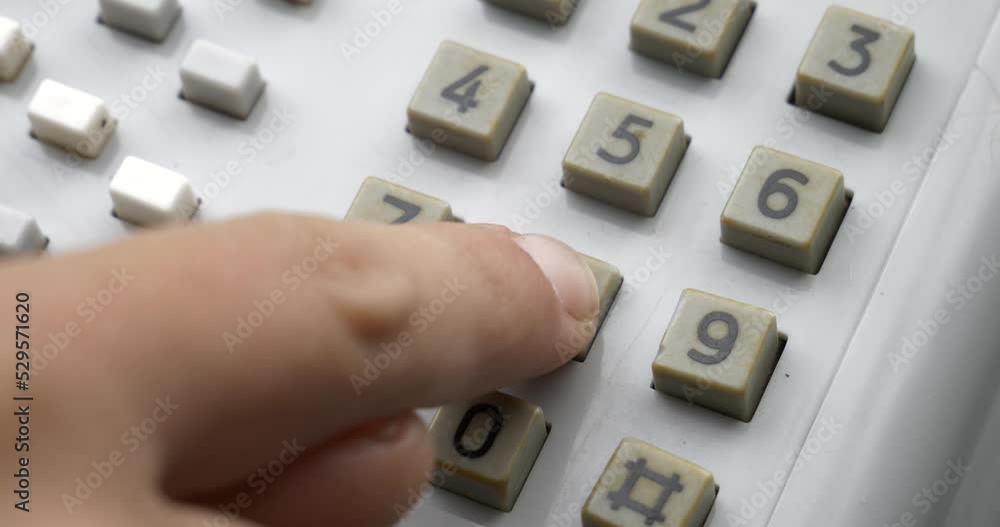 fingers dialing a number on an old landline telephone. High quality 4k ...