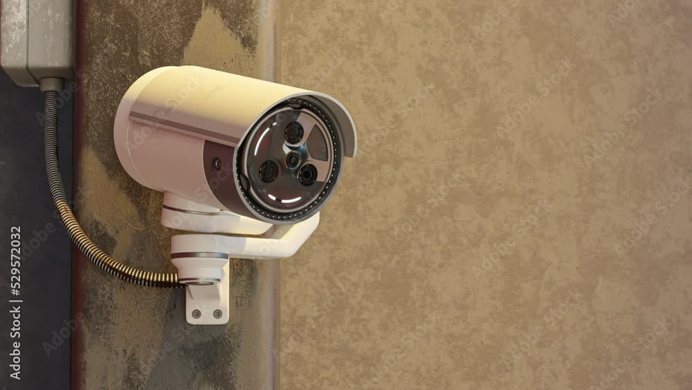 CCTV camera fixed on metal pole on cement wall background. Scan the ...