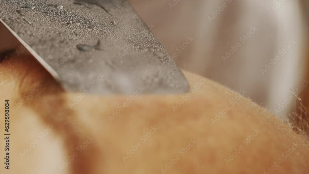 Ultrasonic cleaning of the skin in the forehead area. Close-up video ...