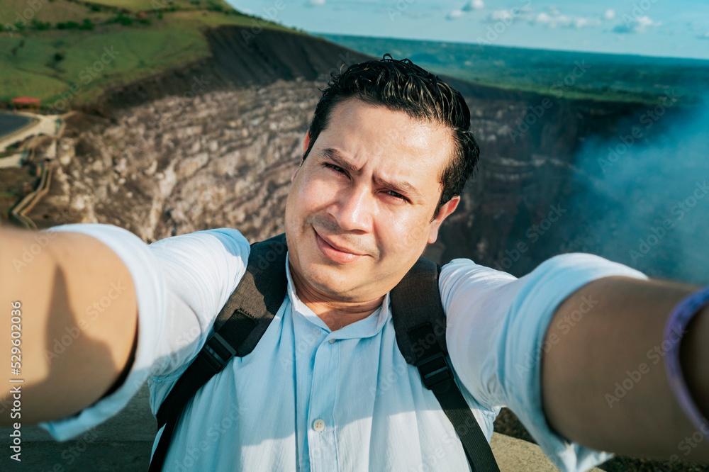 Adventurous people taking a selfie at a viewpoint. Close up of person ...