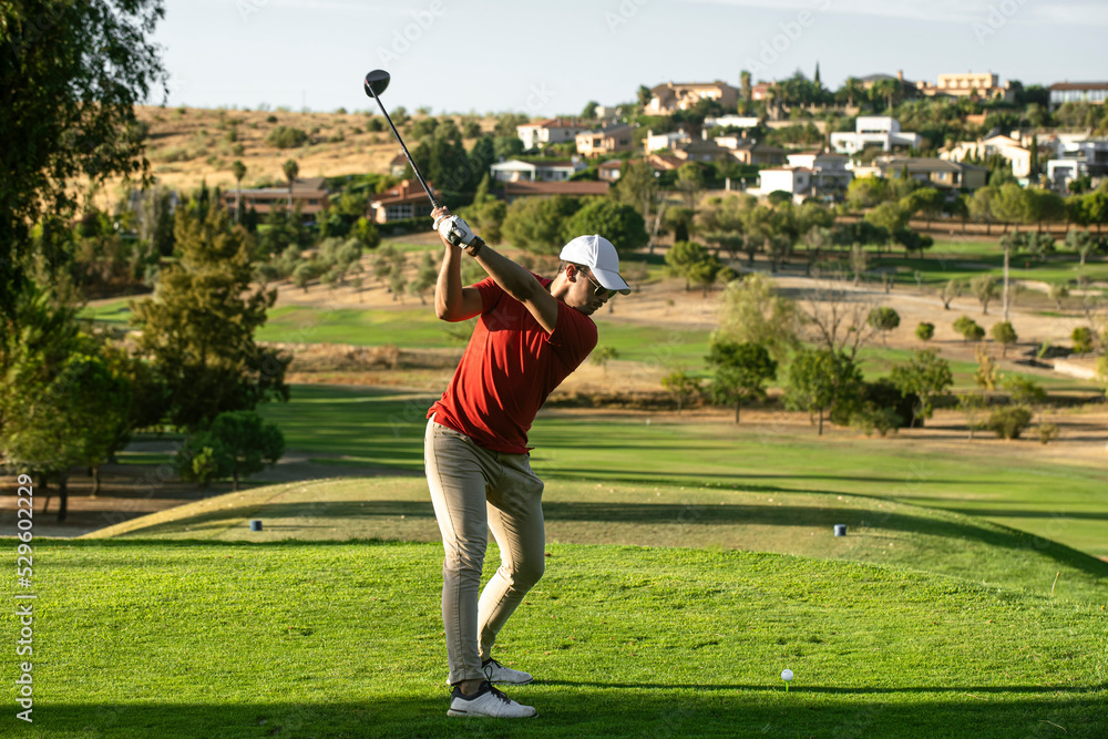 golfer man starting golf swing. Close-up from behind of a golfer ...