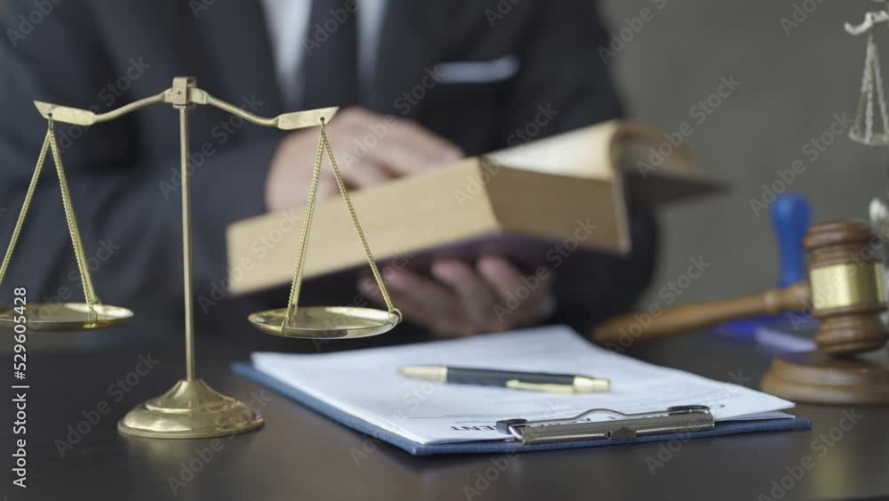 Lawyers read law books in the office. The footage features a Lady ...