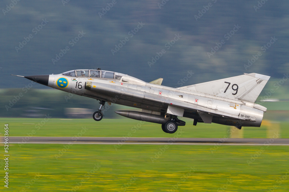 A Saab Draken military jet of the Swedish Air Force landing in Zeltweg ...