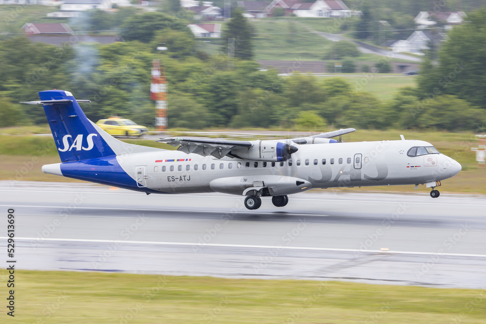 An ATR-72 turboprop airliner of SAS Scandinavian Airlines landing on a ...