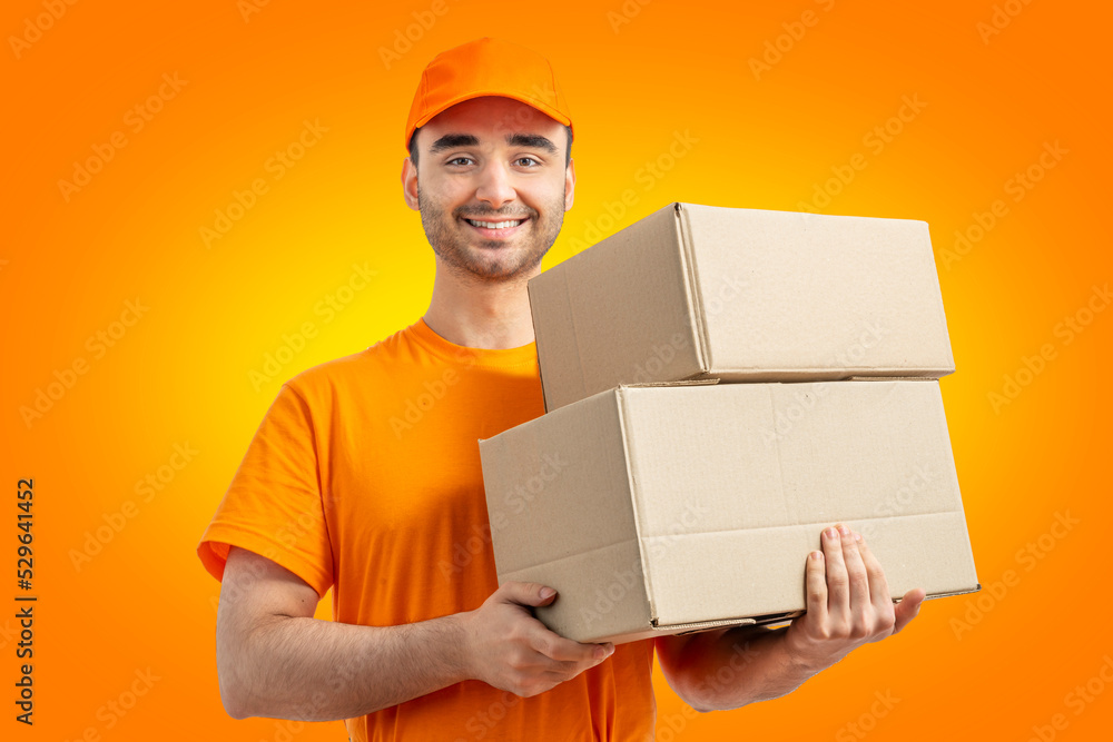 Delivery man with a box. Courier in uniform cap and t-shirt service ...