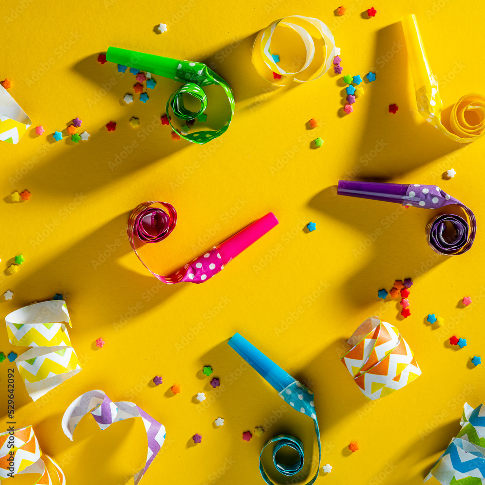 Abstract colored party background. Multi-colored party horns ...