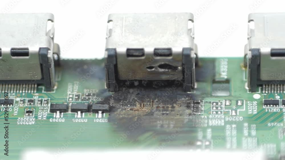 Damaged motherboard, burnt marks, unusable, caused by short circuit ...