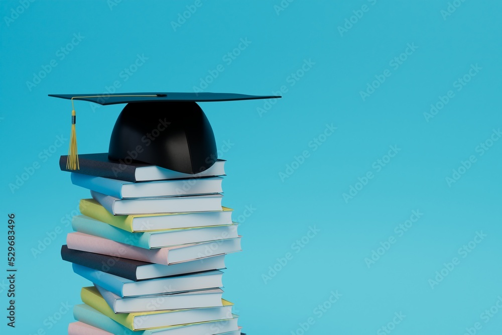 return to university studies. a stack of books and a graduation cap on ...