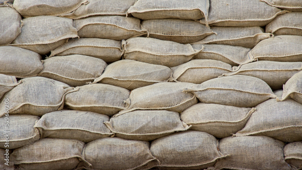 Sandbag flood protection barricade wall Background texture. Stock Photo ...