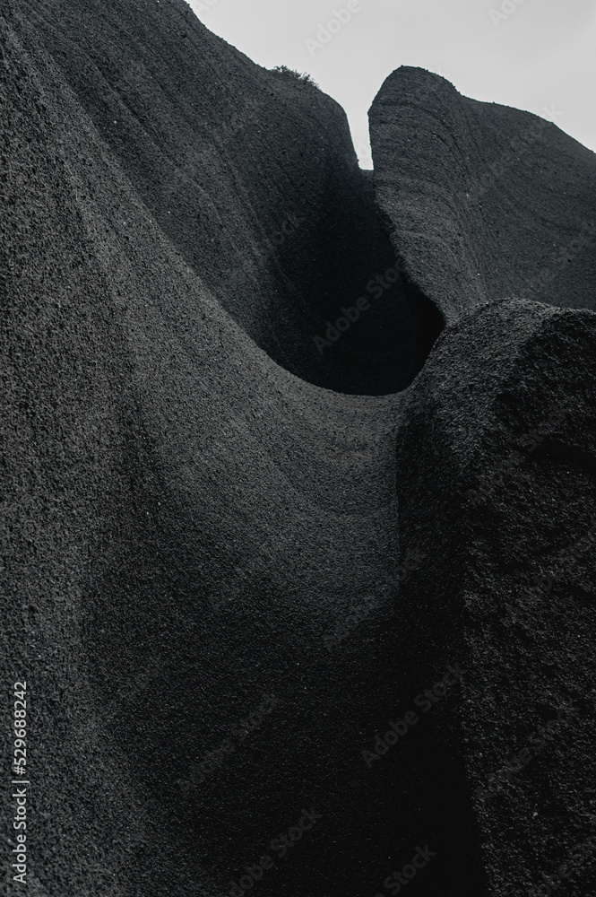 a miracle of nature is a rock made of black volcanic ash with smooth ...