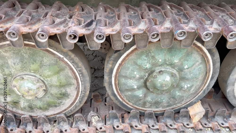 A caterpillar on a tractor and a tank. Bulldozer crawler mechanism ...