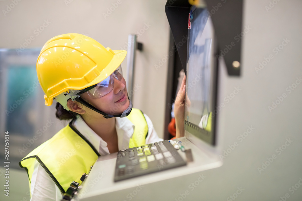 Female engineer check monitor screen of automate robot machine Stock ...