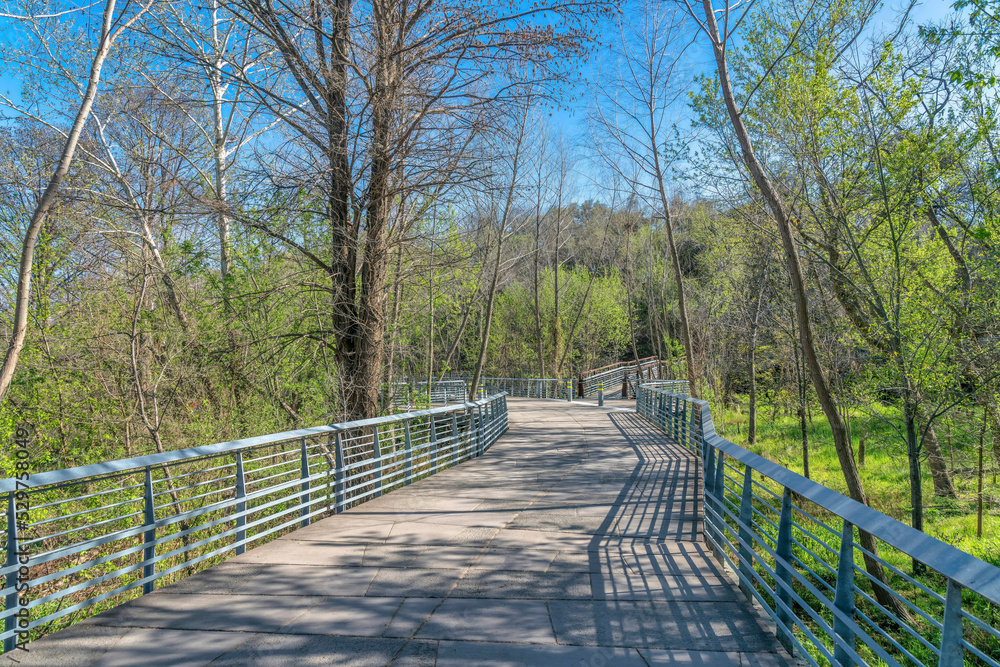 Austin, Texas- Concrete bike path and pedestrian pathway with railings ...