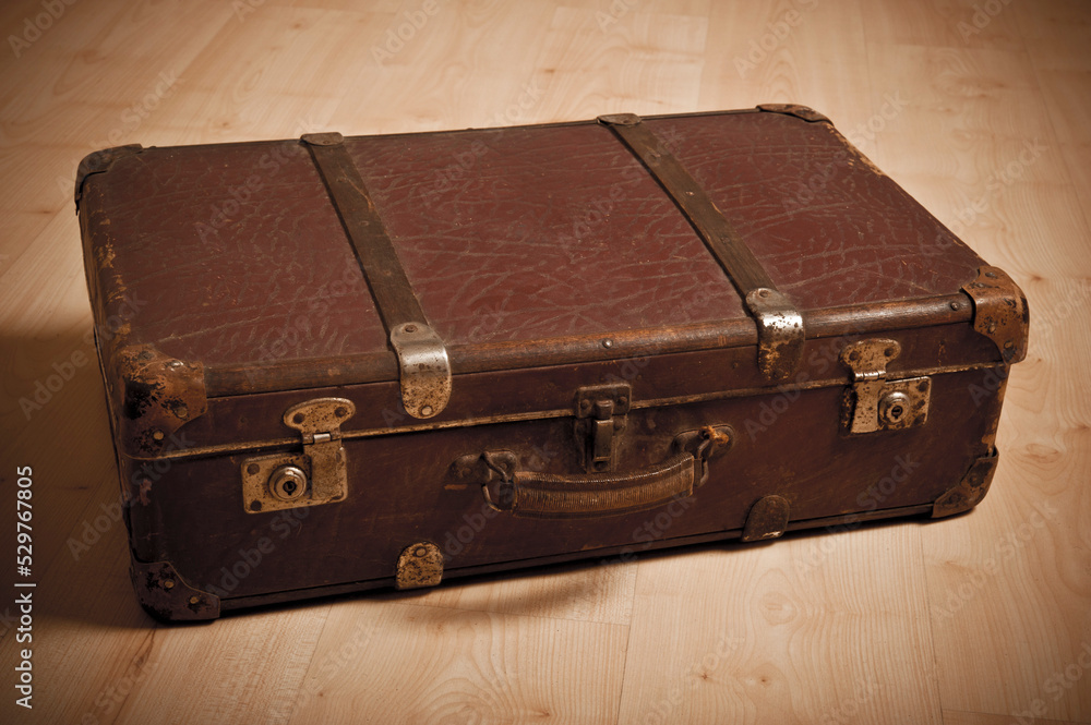 vintage worn out and damaged brown suitcase Stock Photo | Adobe Stock