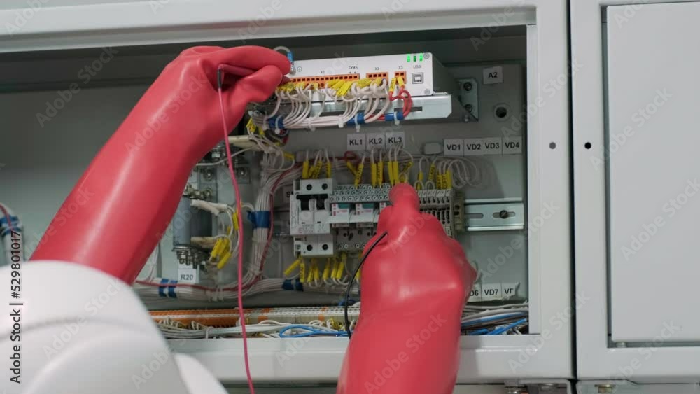 Electrical engineer working check the electric current voltage and ...