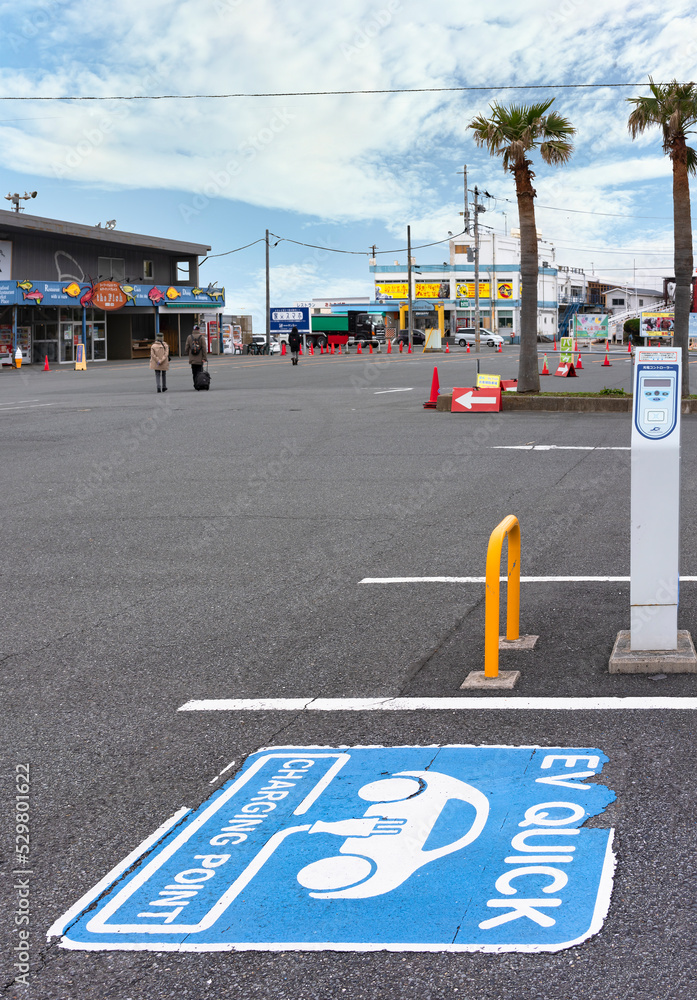 chiba, japan - july 18 2022: EV quick charging point sticker on asphalt ...