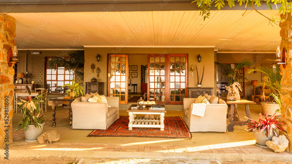 Rustic African resort, safari lodge with tropical garden patio and ...