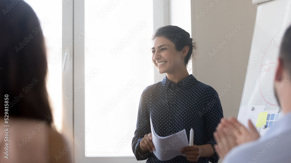 Happy cheerful Indian presenter getting applause, approval from ...