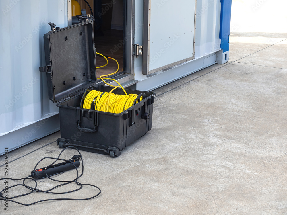 Electrical wires. Reel extension cord in plastic case. Extension cord ...