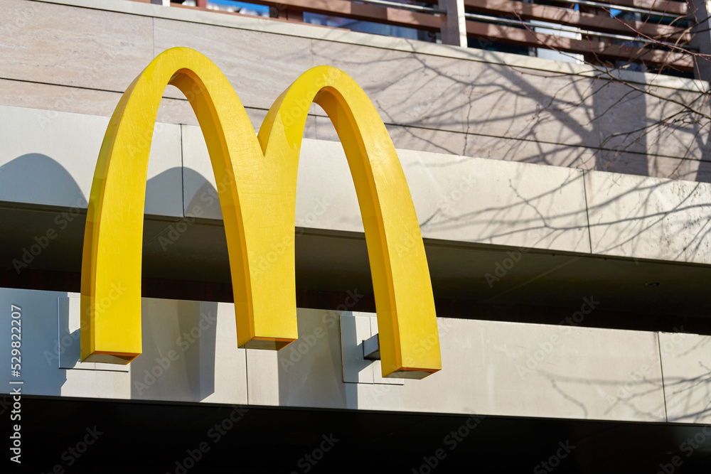 McDonalds logo on fast food restaurant branch, yellow macdonald logo of ...