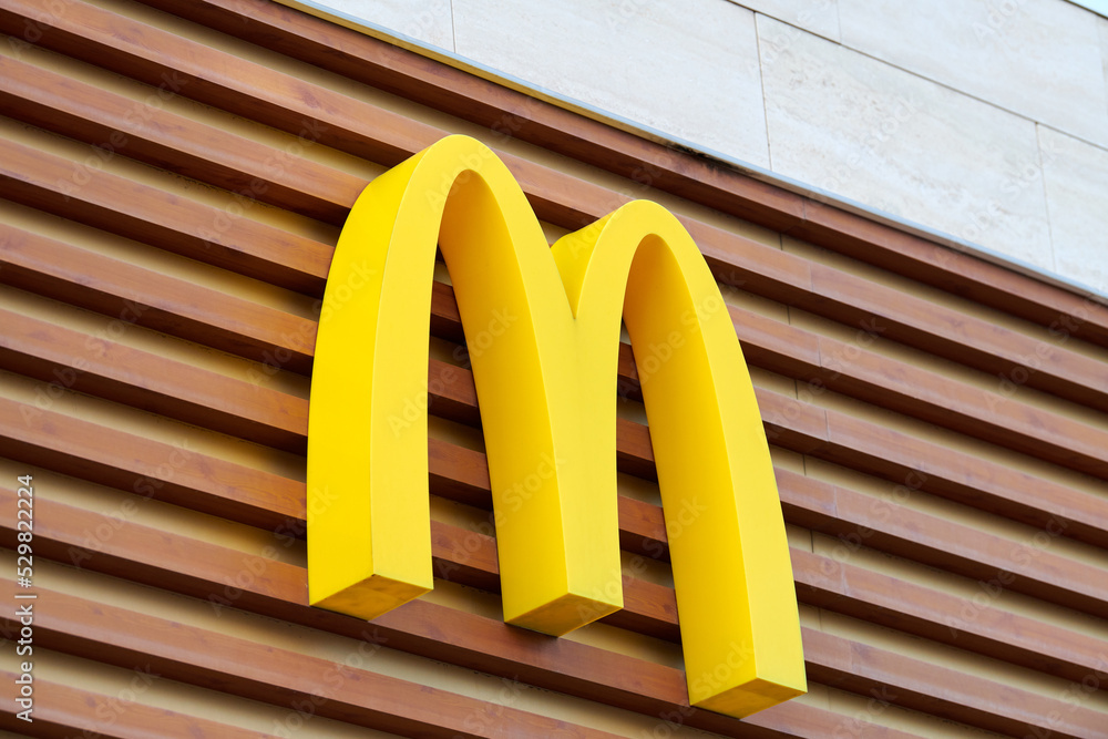 McDonalds logo on fast food restaurant branch, yellow macdonald logo of ...