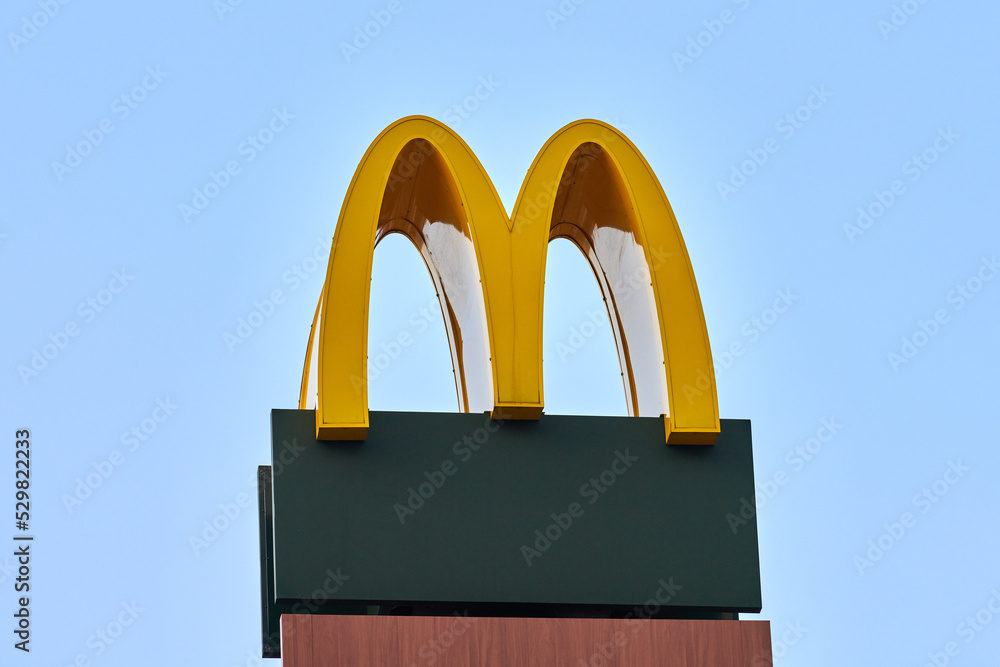 McDonalds logo roadside sign of fast food restaurant branch, yellow ...