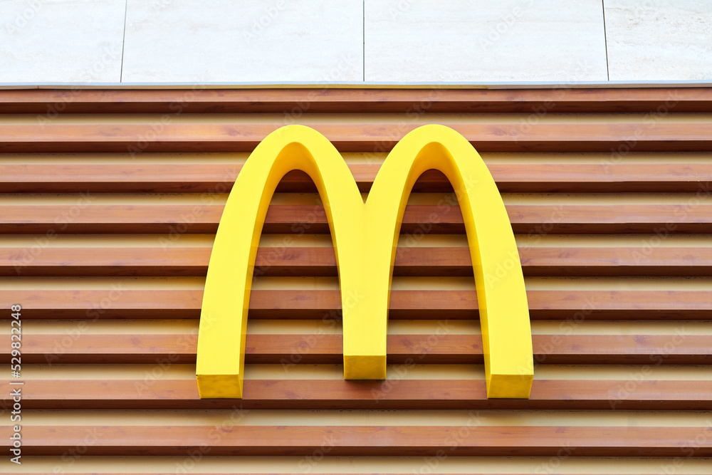 McDonalds logo on fast food restaurant branch, yellow macdonald logo of ...