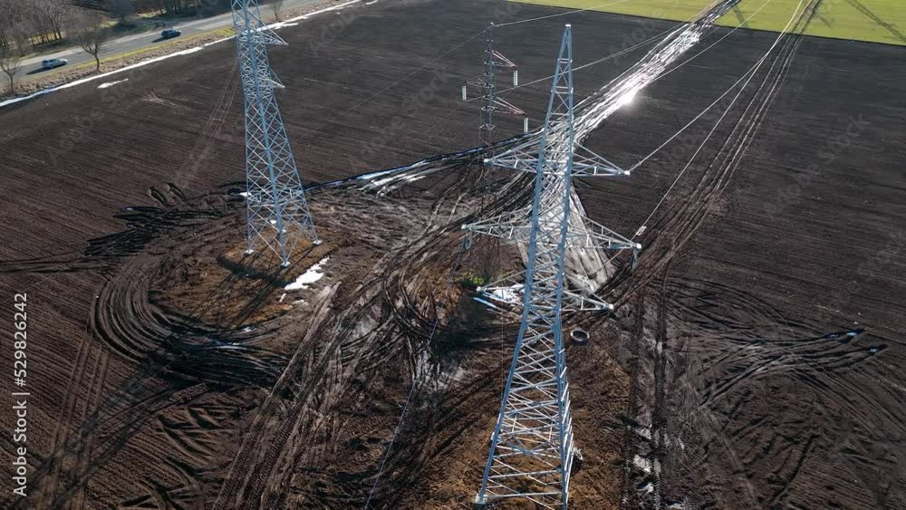 Aerial circling view of steel erector workers strengthen a newly ...