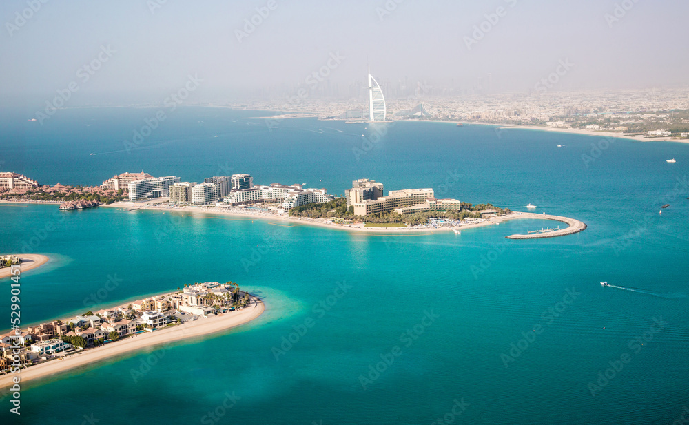 The Palm Jumeirah. Burj Al Arab distant view, holidays villas, beaches ...