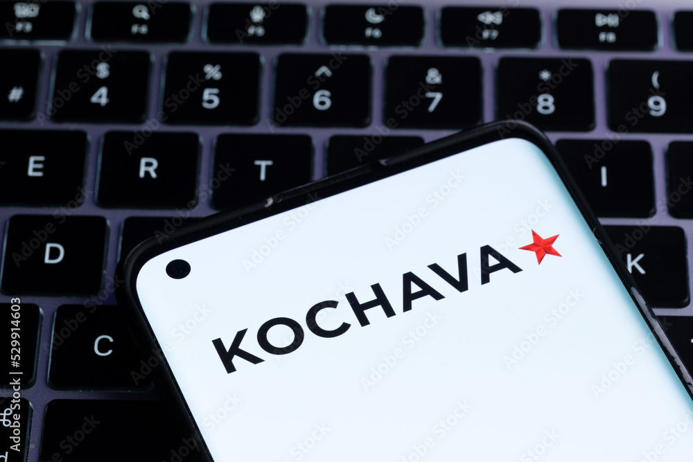 Kochava Inc company logo seen on smartphone screen placed on keyboard ...