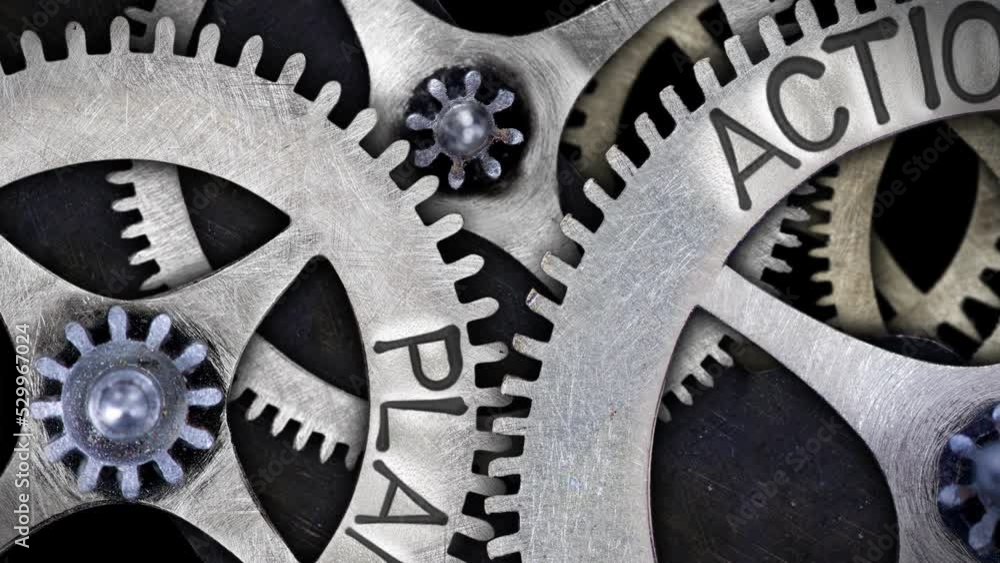 Group of rotating tooth wheels with Plan and Action sign imprinted on ...