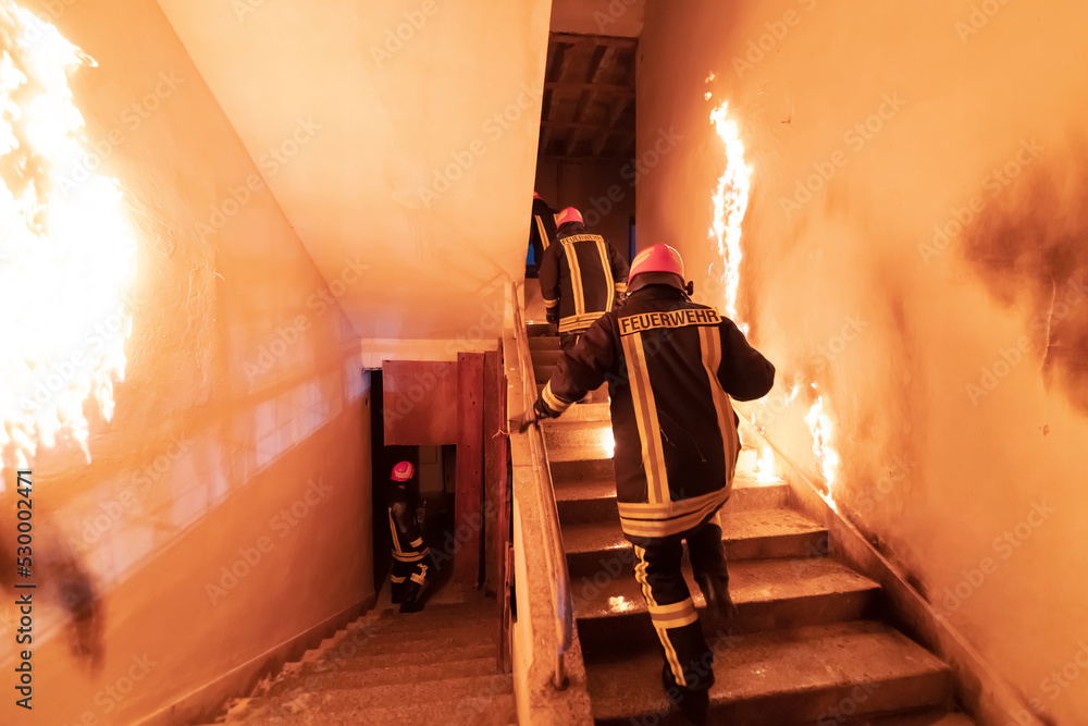 Brave Fireman going upstairs to save and rescue people in a Burning ...