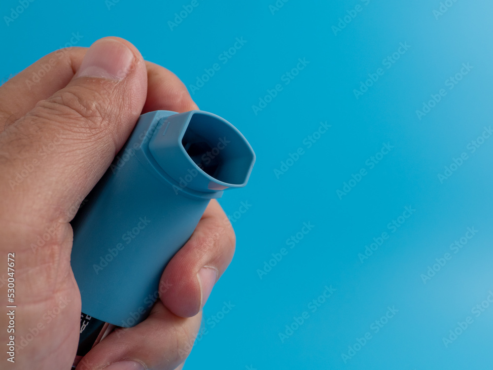 Asthma medicine. Inhaler for the treatment of bronchial asthma on a ...