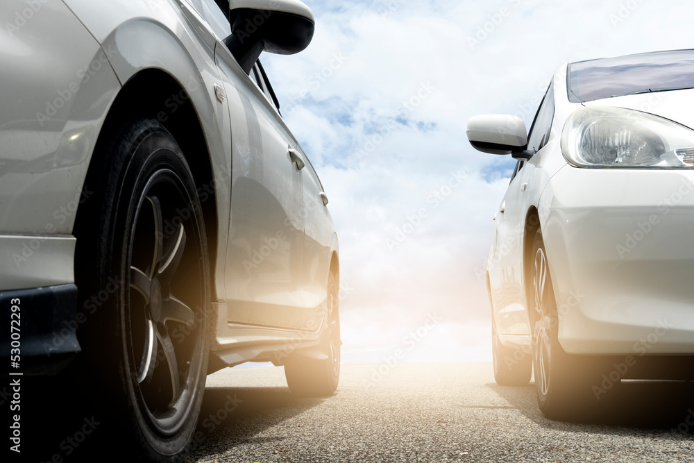 Abstract of beside of two cars on the asphalt road. Park the car ...