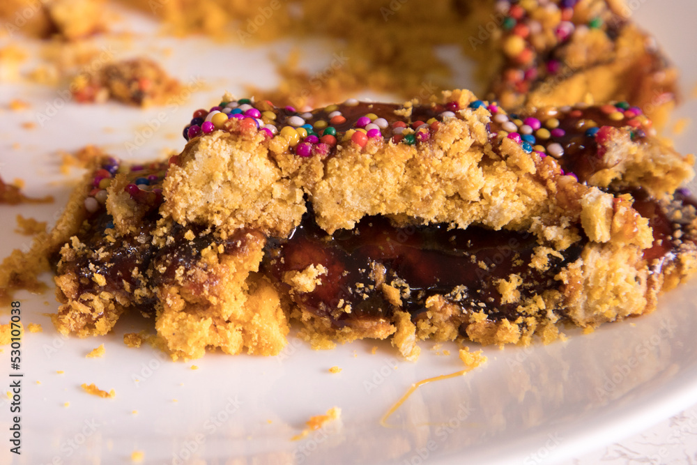 Girl eating Turron dona pepa dough with honey traditional peruvian ...