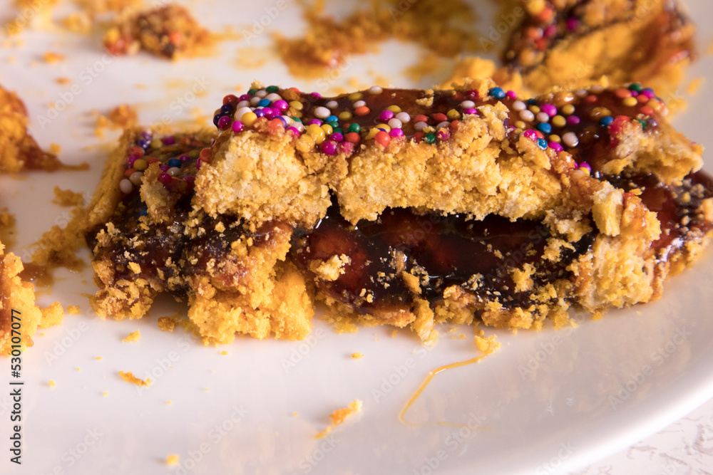 Girl eating Turron dona pepa dough with honey traditional peruvian ...