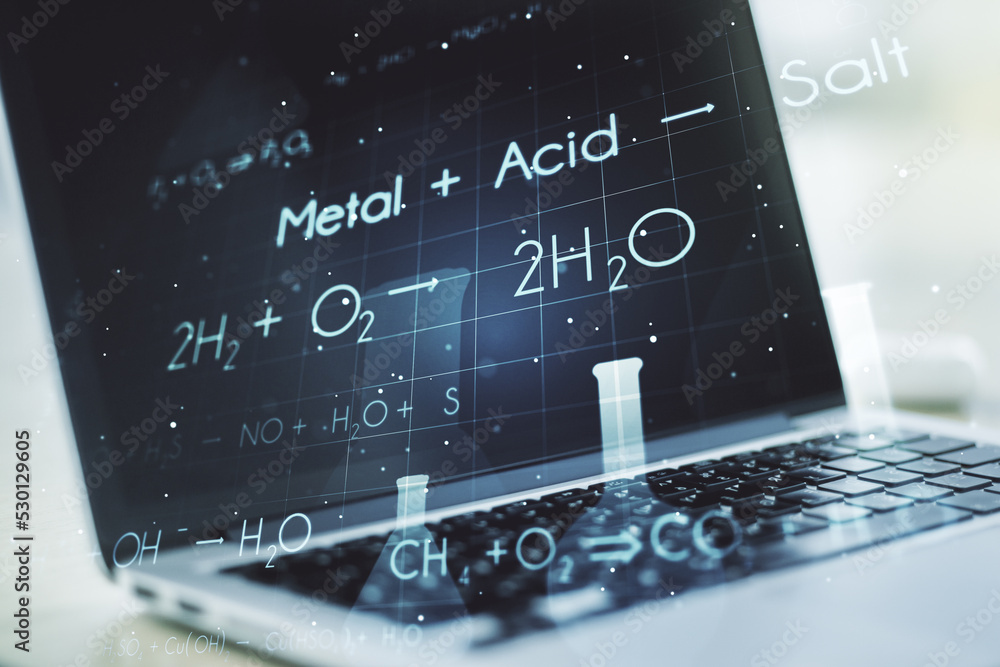 Double exposure of creative chemistry concept on laptop background ...