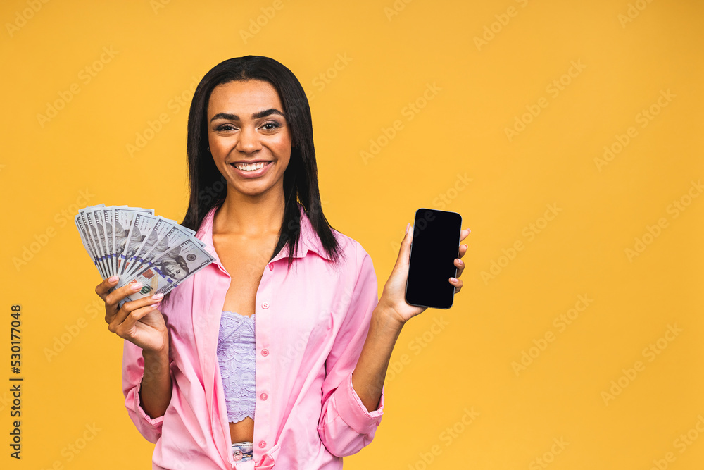 Happy winner. Portrait of african american black woman holding lots of ...