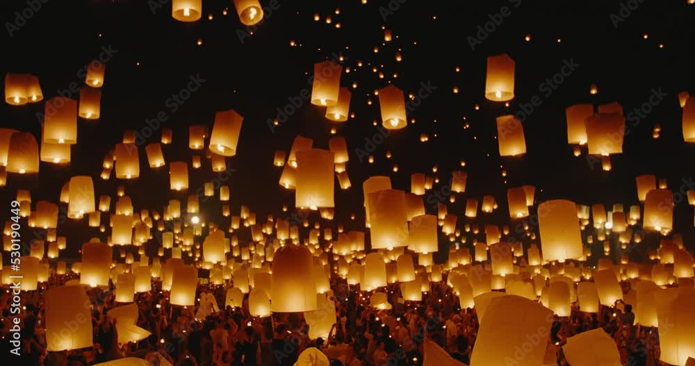 Amazing sky lanterns lifting up into the night sky, world travel and ...