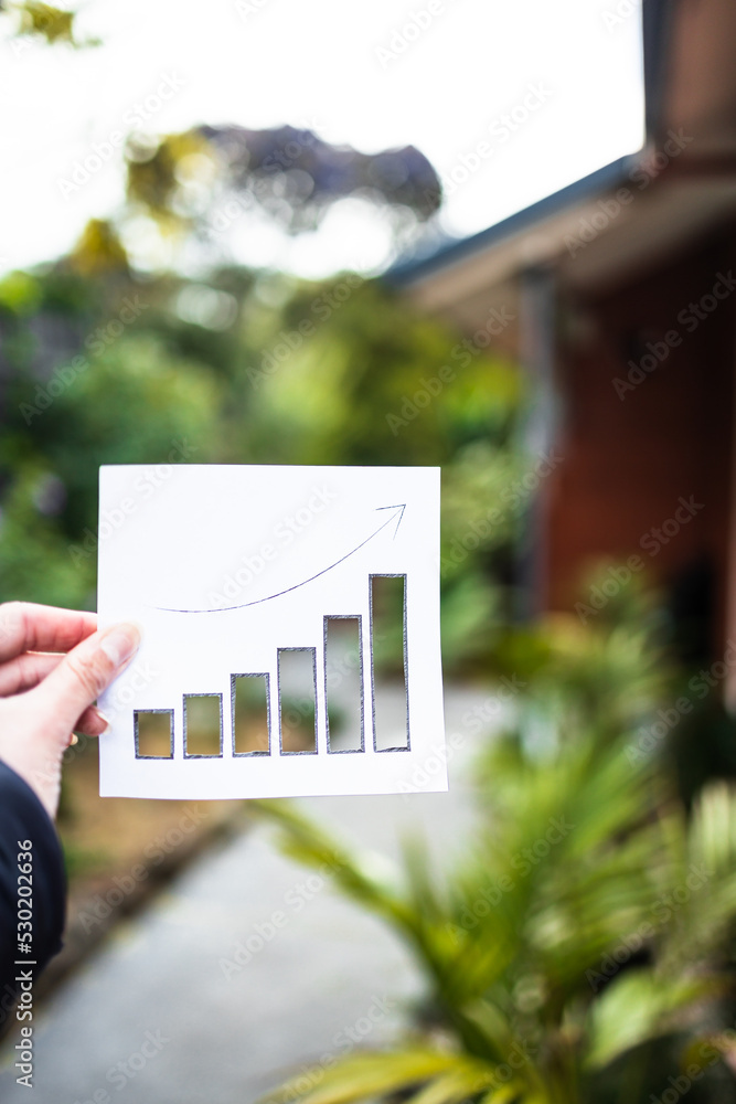 property value and return on investment or rent price, hand holding ...